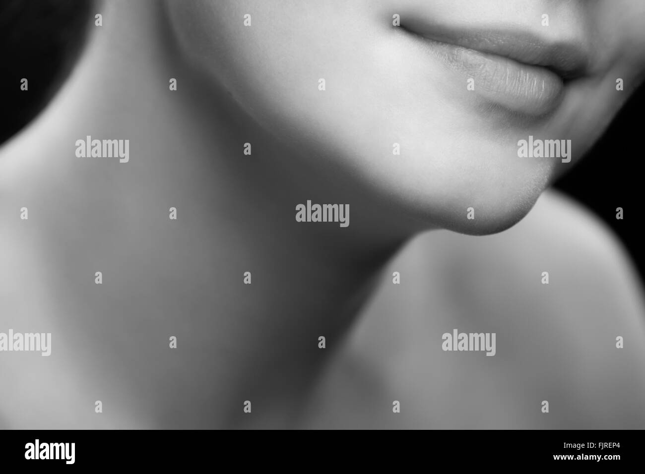Woman neck shoulder and lips close-up Stock Photo - Alamy