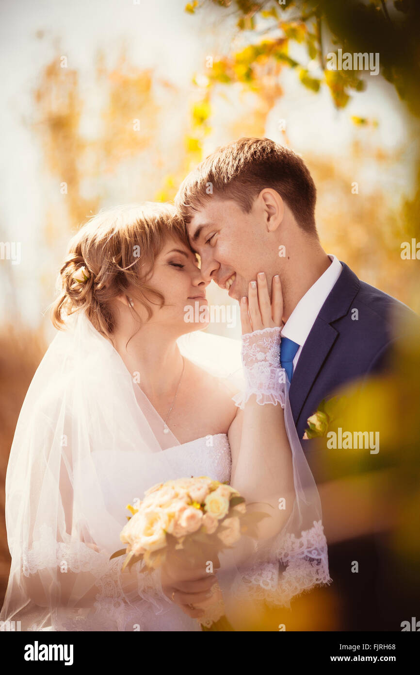 young bride and groom on the bluer background Stock Photo - Alamy