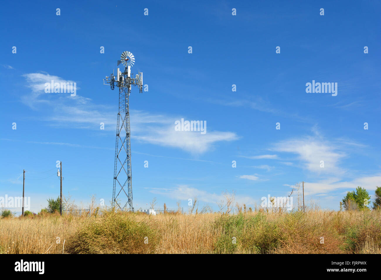 Cell Tower Disguised as a Farm Windmill Stock Photo - Alamy