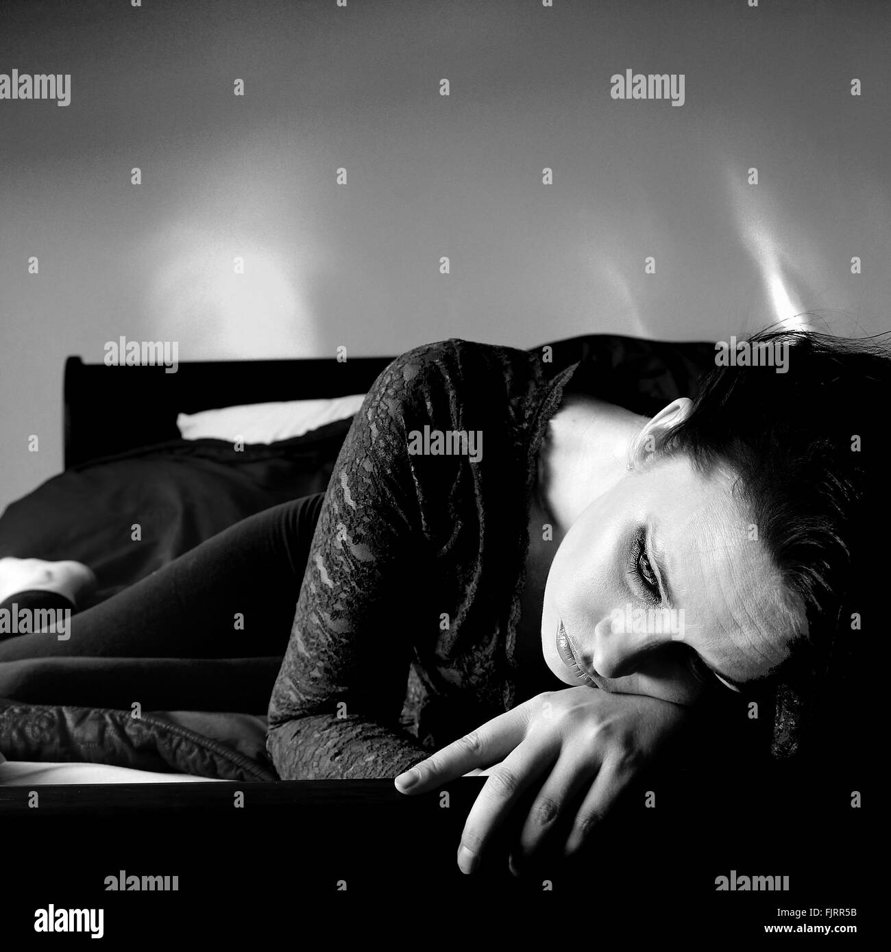 Sad woman relaxing bed home bed Black and White Stock Photos & Images ...