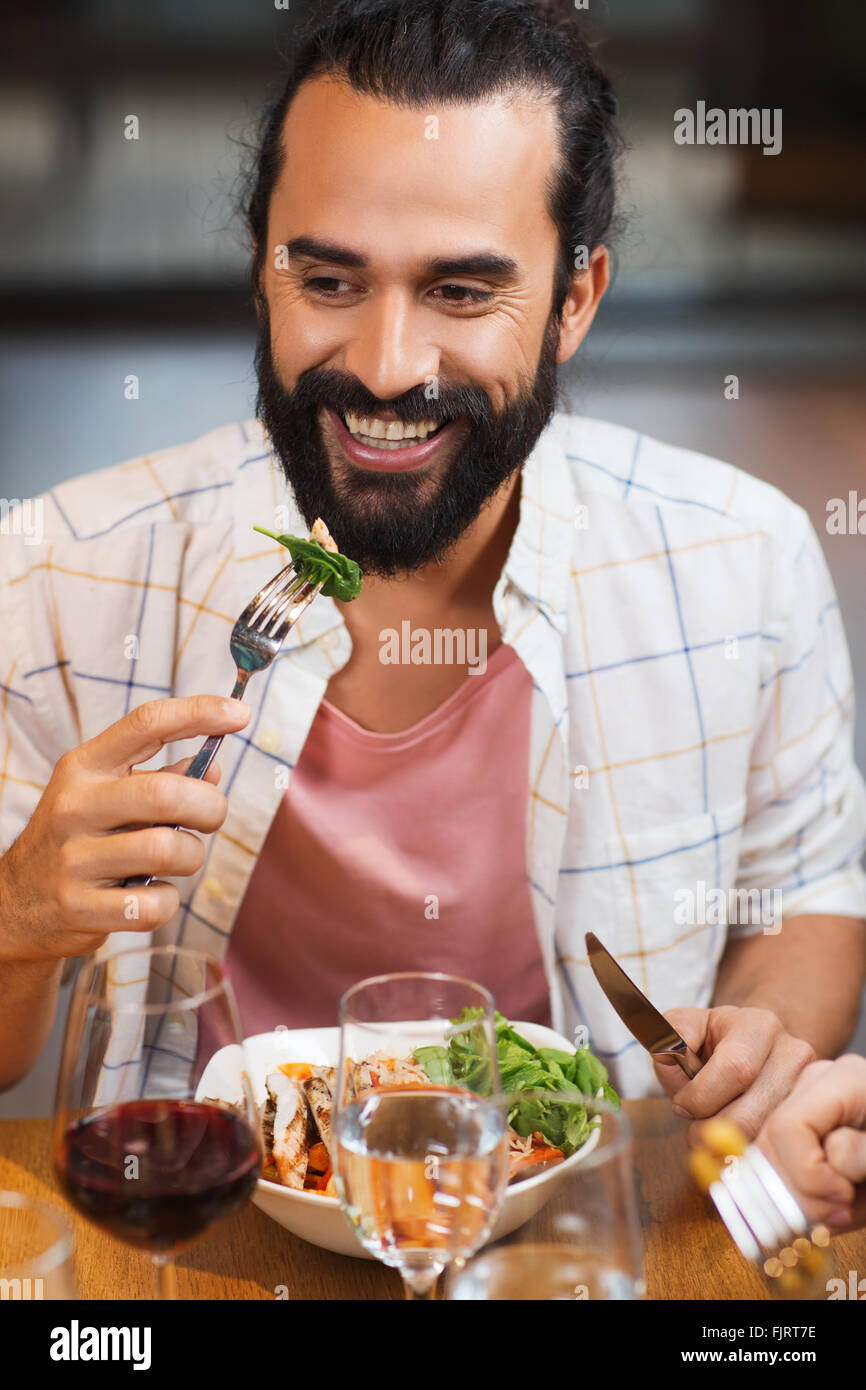 happy man having dinner at restaurant Stock Photo - Alamy
