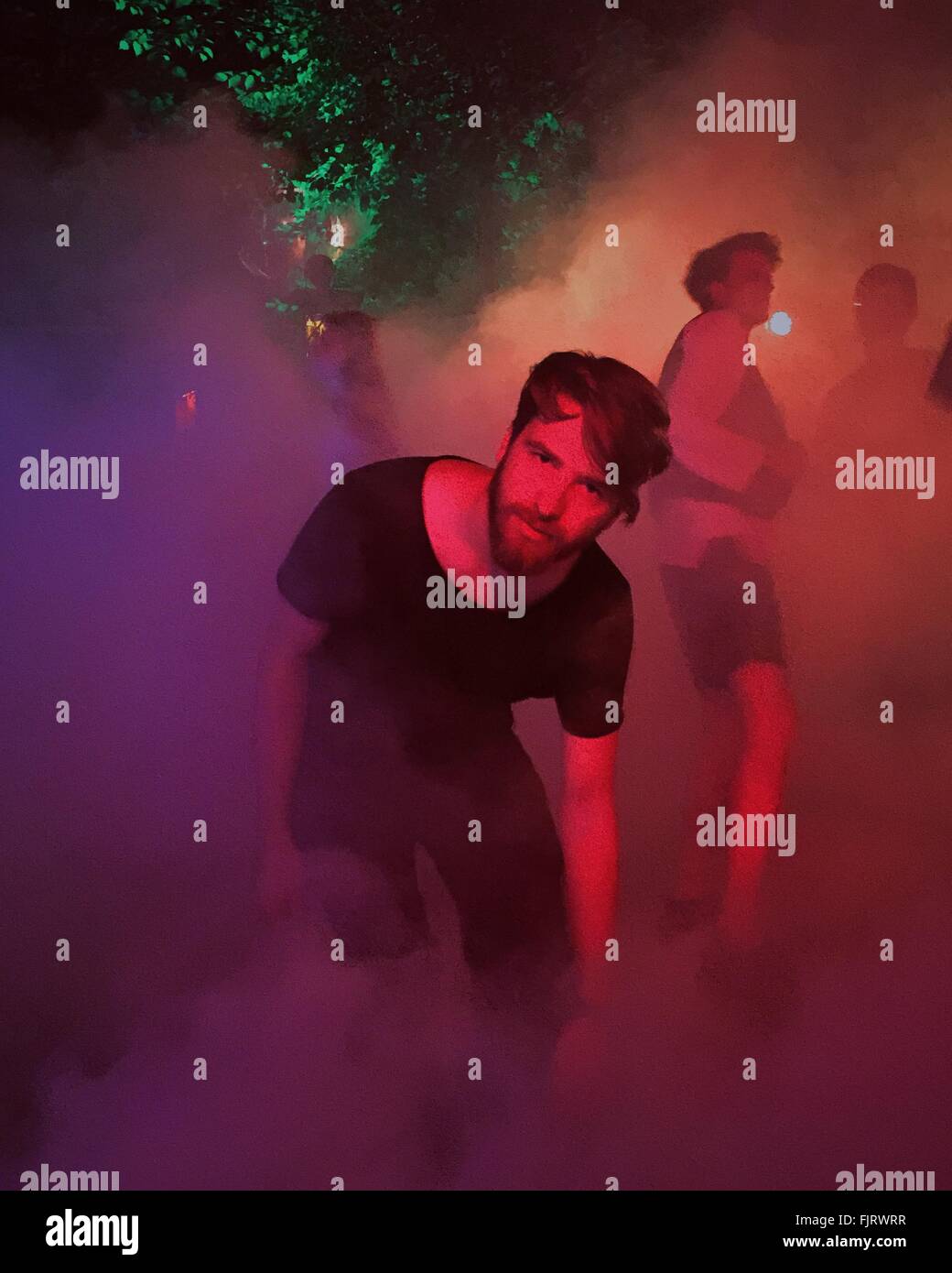 Portrait Of Man Enjoying In Smoke Stock Photo - Alamy