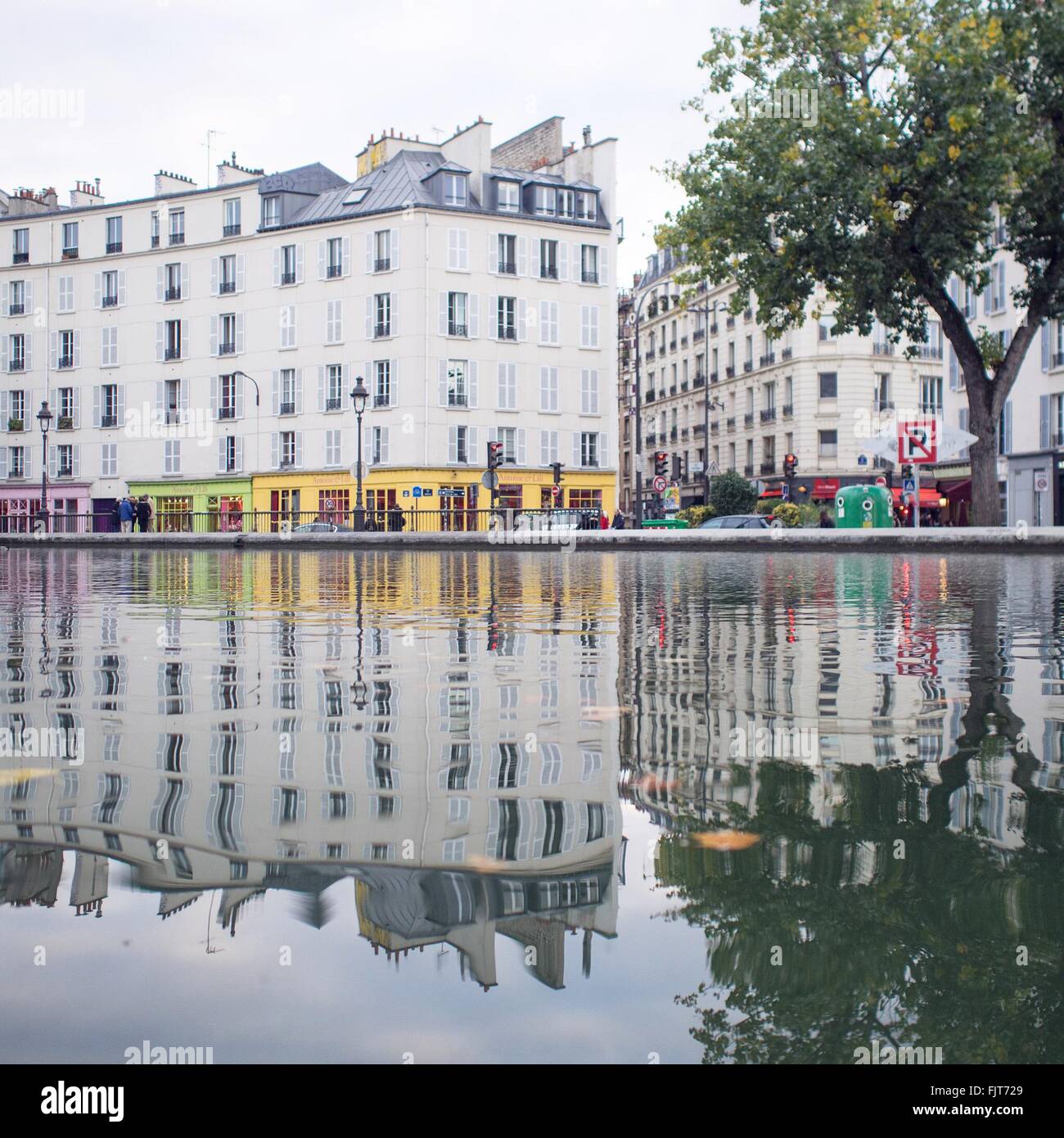 Reflection Of Building In Water Stock Photo - Alamy