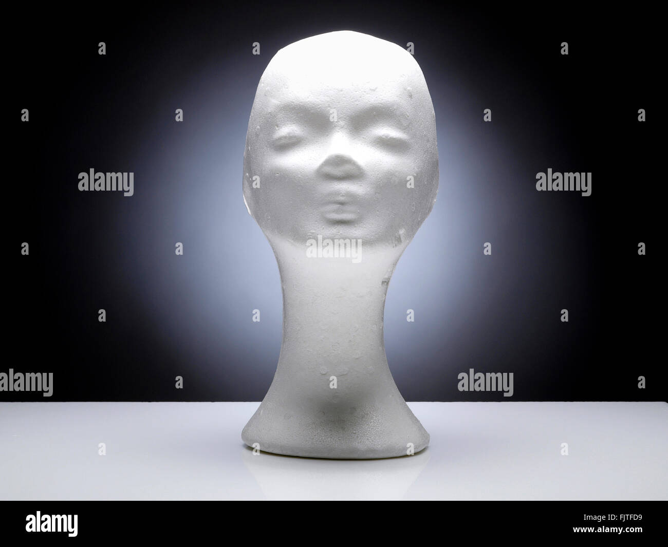 White dummy female head on black background Stock Photo - Alamy