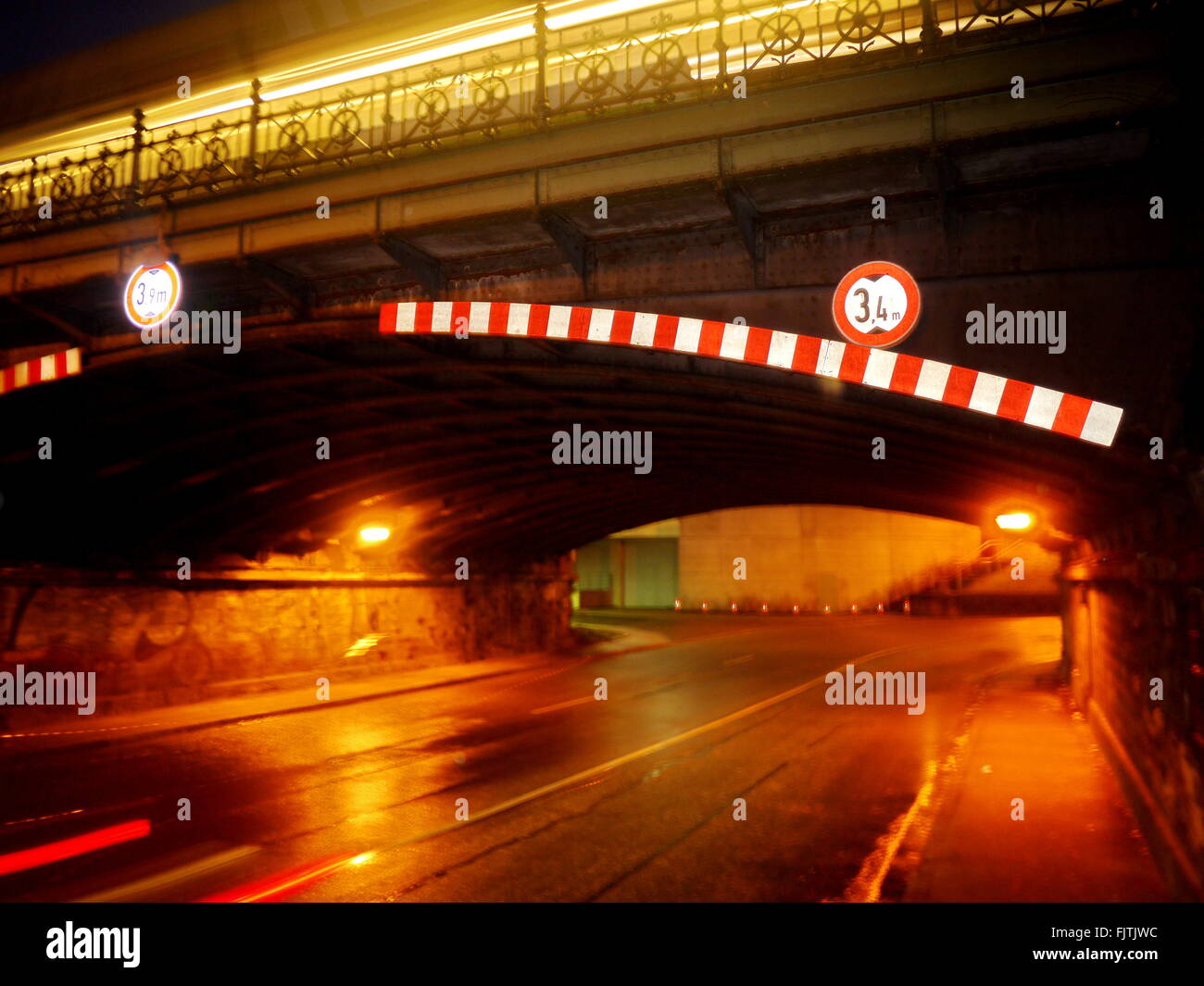 Empty road below bridge night bridge hi-res stock photography and ...