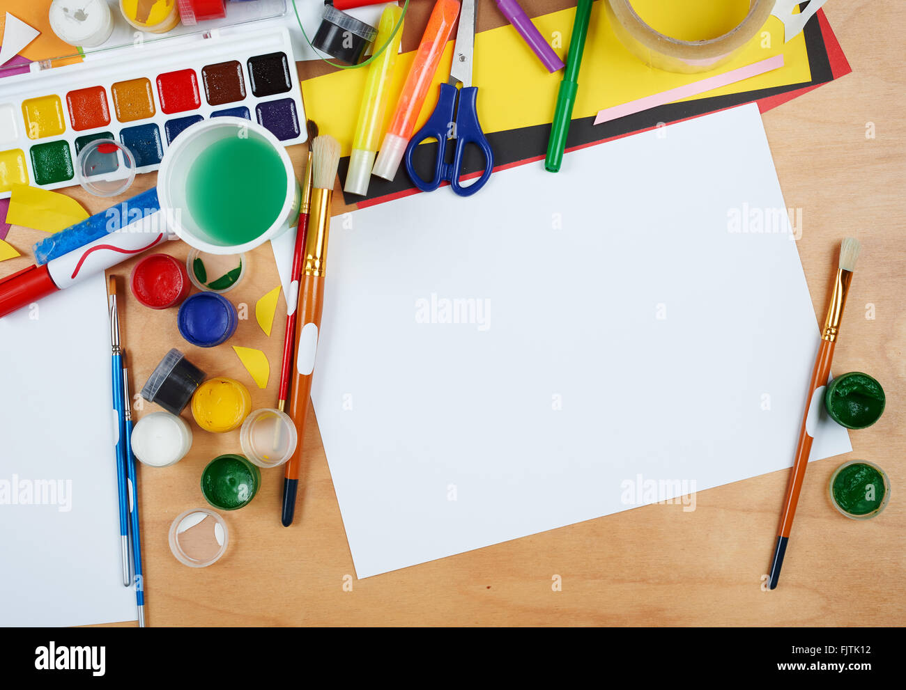 artwork workplace with creative accessories, art tools for painting and ...