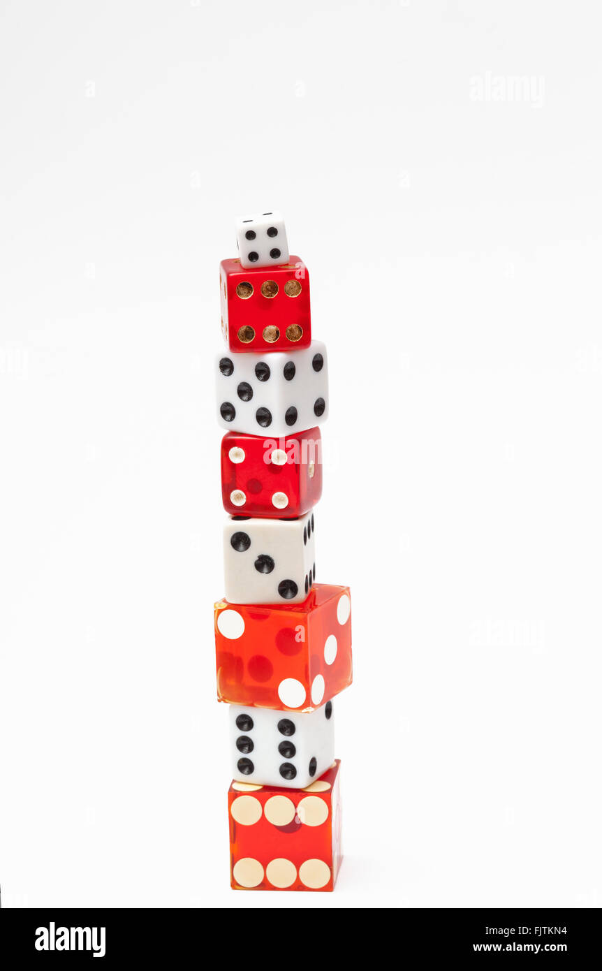 Red and white dice stacked up Stock Photo - Alamy