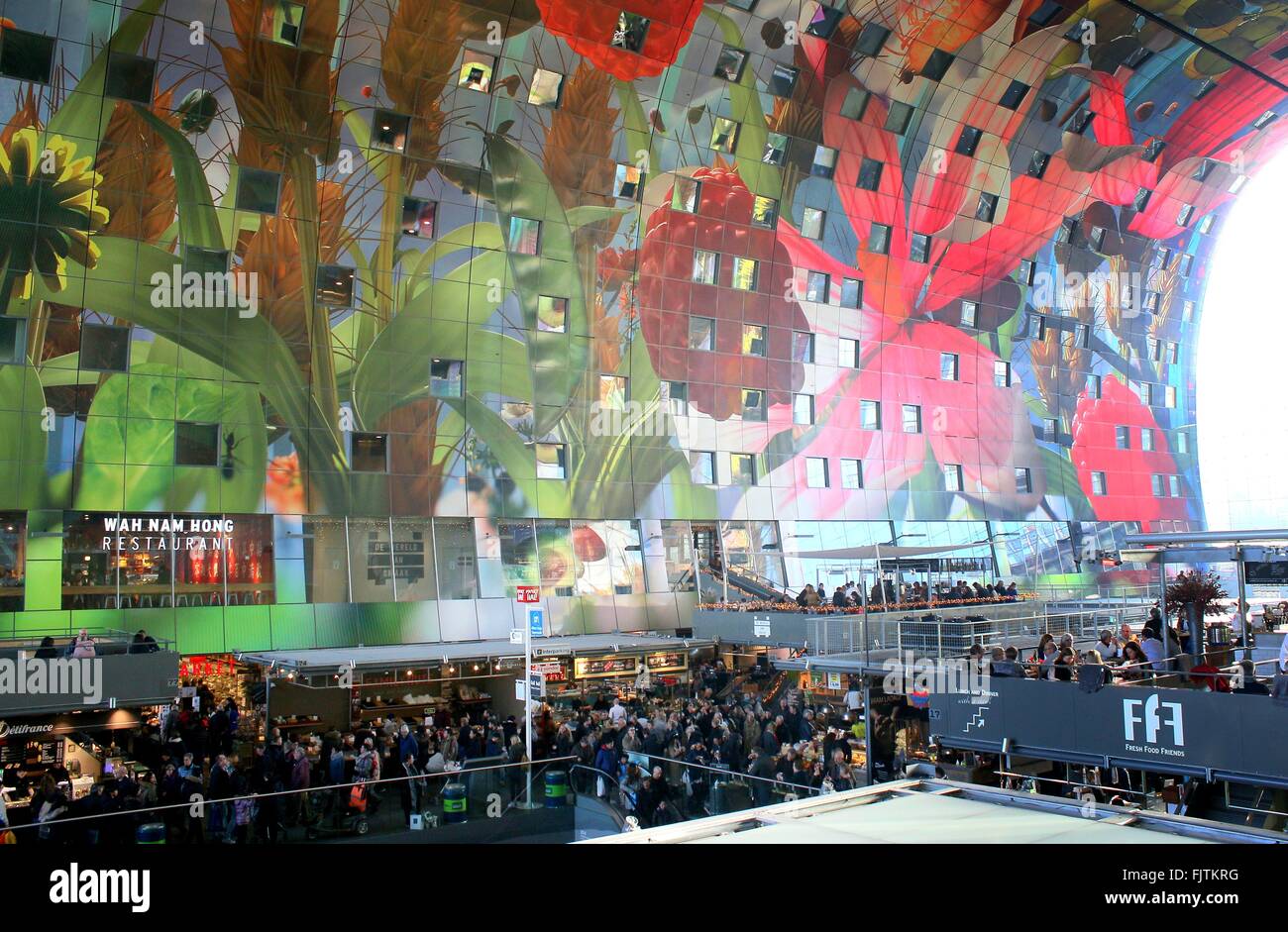Extremely colourful artwork on the ceiling of the Rotterdamse Markthal ...