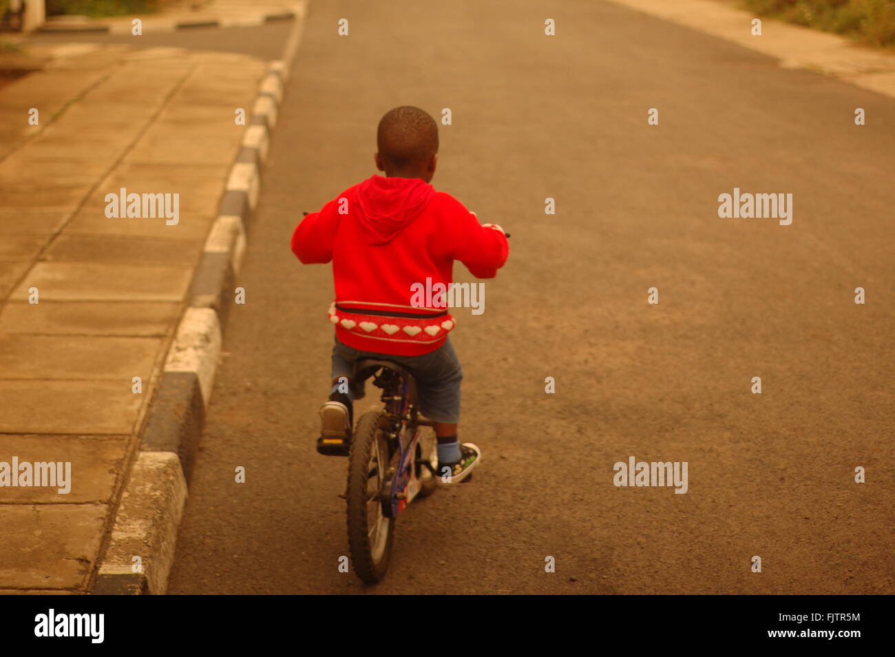 African american boy on bicycle hi-res stock photography and images - Alamy