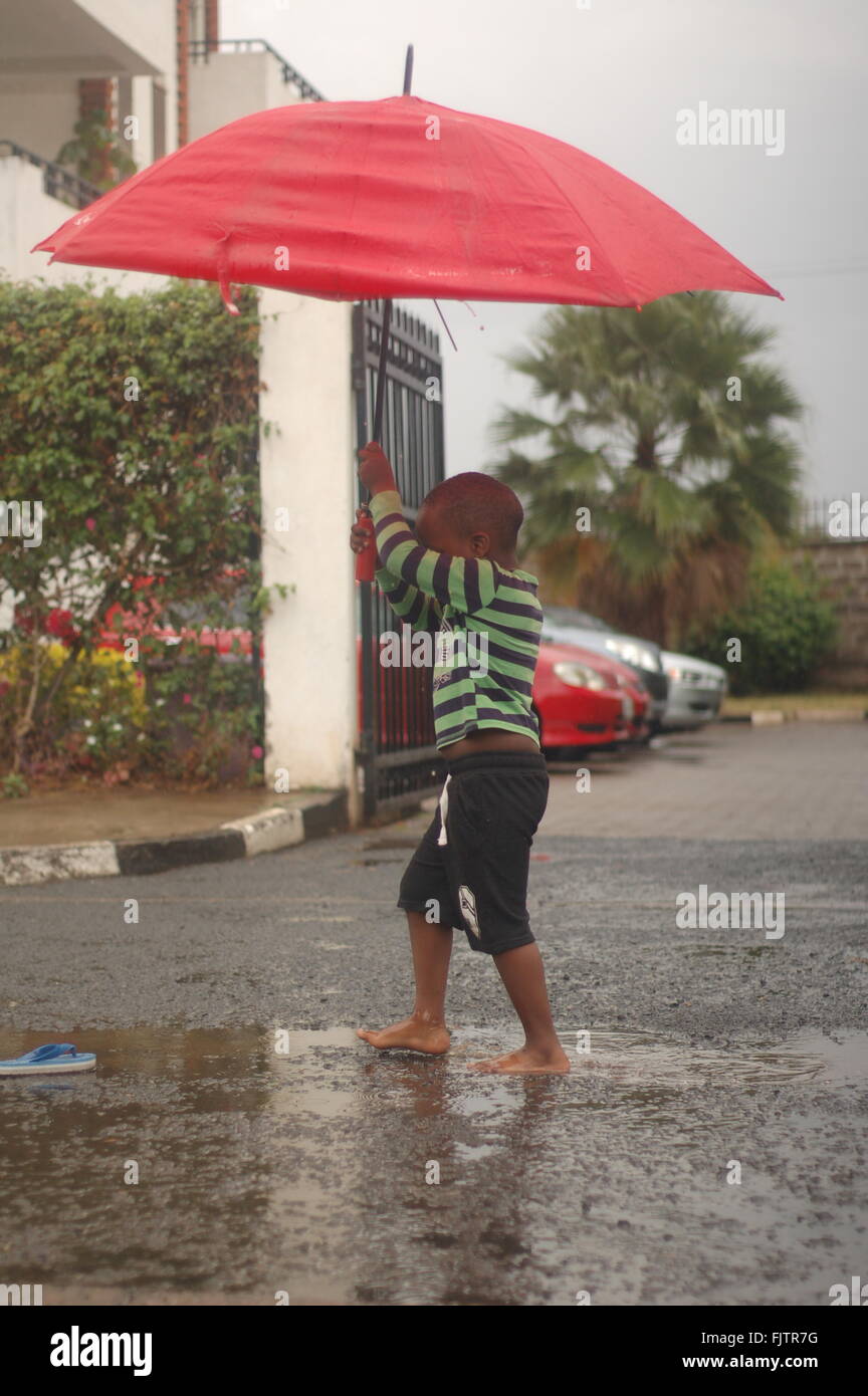 Boy in the rain hi-res stock photography and images - Alamy