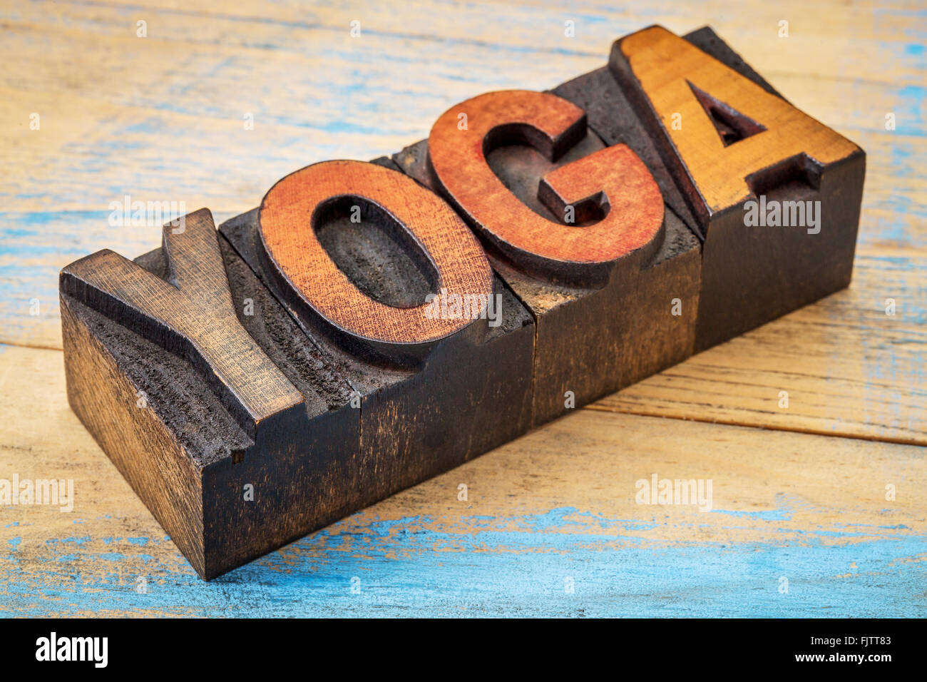 yoga word - text in vintage wood letterpress type blocks stained by ...