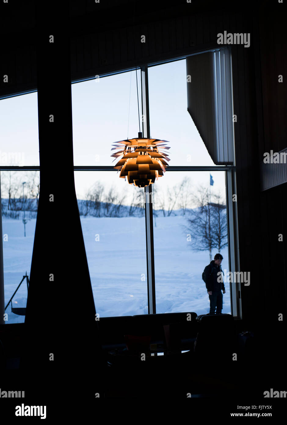 Light lampshade in window, snow outside Stock Photo - Alamy