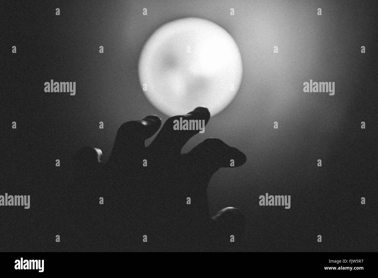 Hand full moon hi-res stock photography and images - Alamy