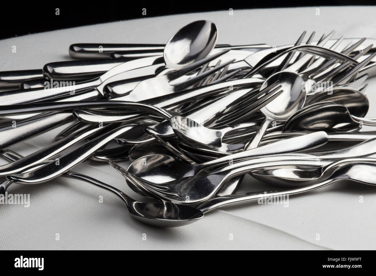 Stack of spoons and forks Stock Photo - Alamy