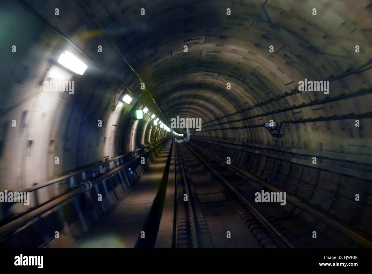 Empty Railroad Tracks In Tunnel Stock Photo - Alamy