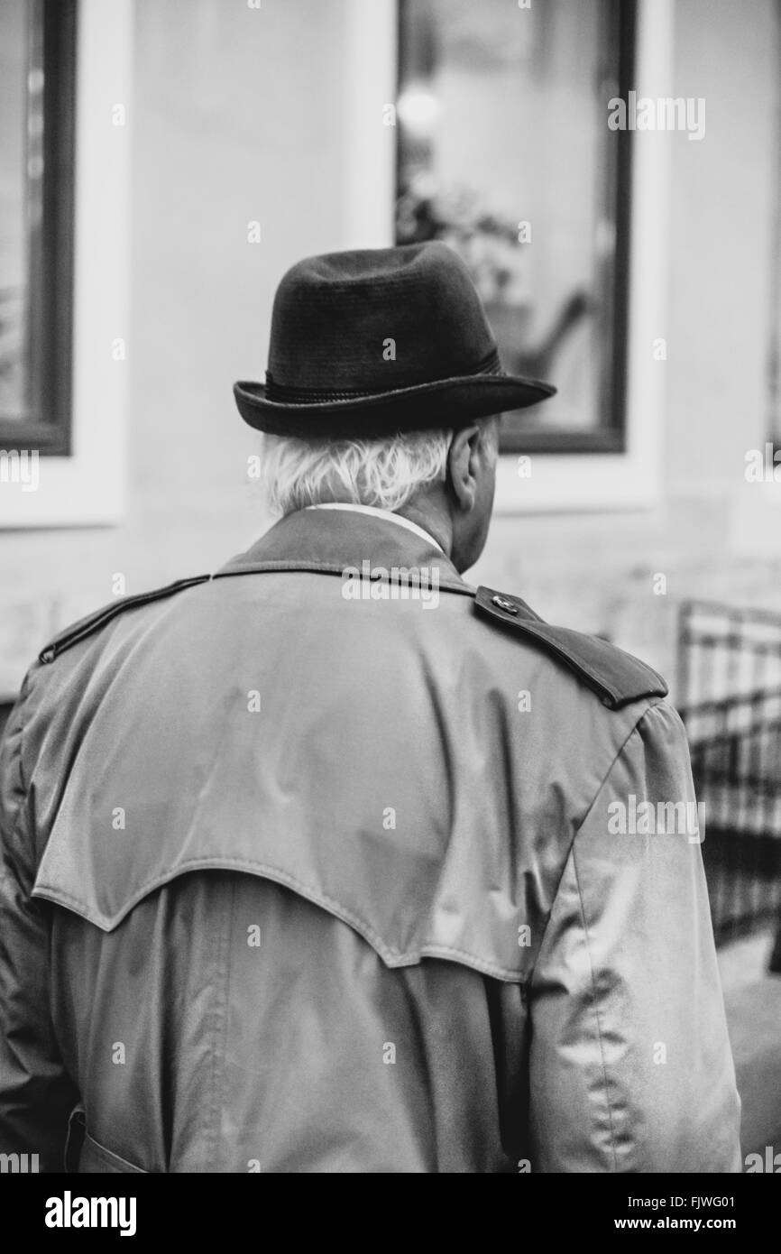 Rear View Of Man Wearing Hat Standing By Building Stock Photo - Alamy