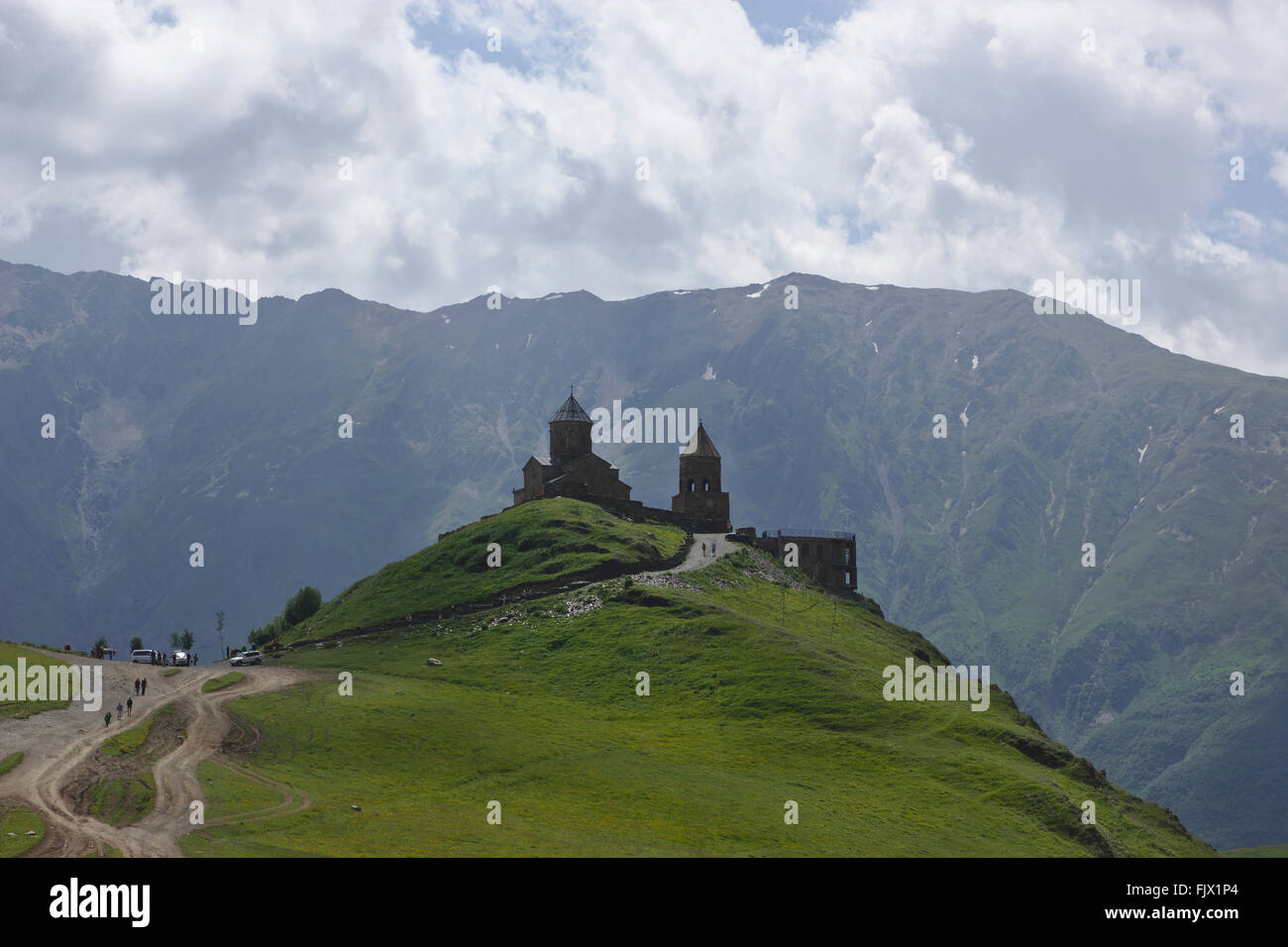 Sameba Church on a mountain near Kazbegi (Stepantsminda), Georgia Stock ...