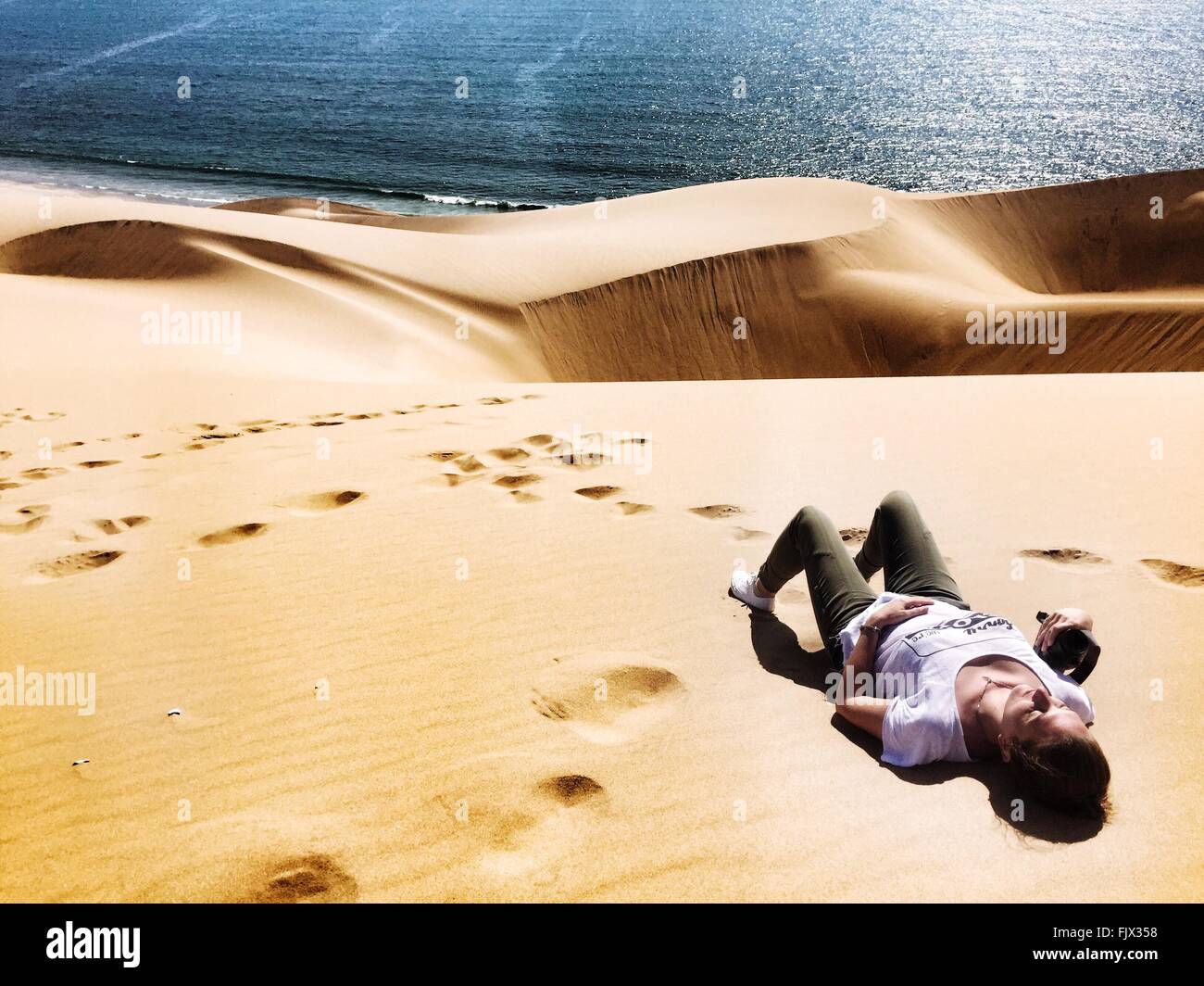 Woman lying in desert hi-res stock photography and images - Alamy