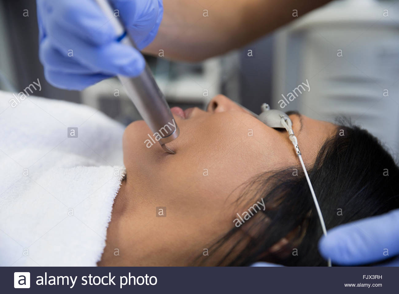 Woman and facial treatment hi-res stock photography and images - Alamy