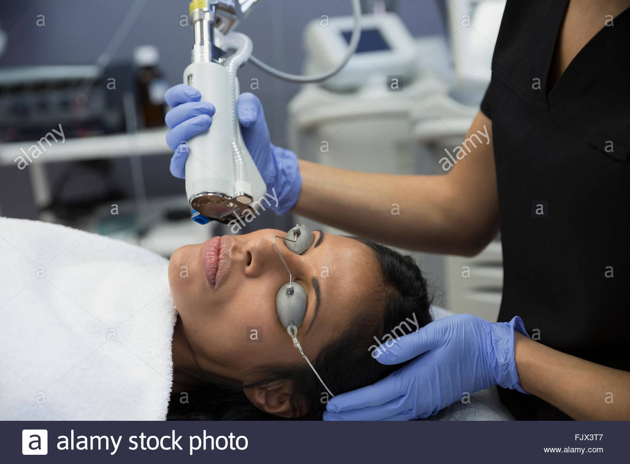 Woman and facial treatment hi-res stock photography and images - Alamy