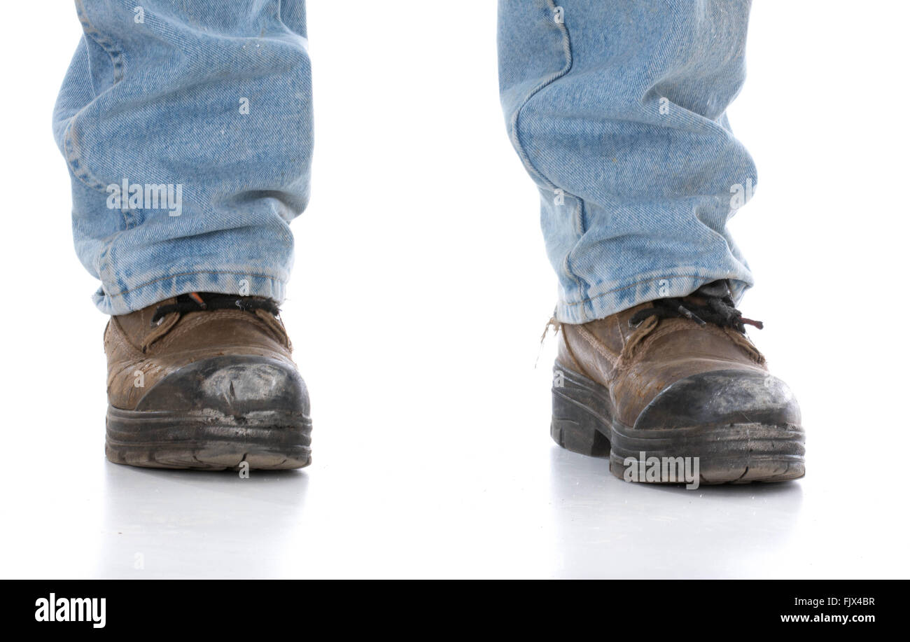man's legs wearing workboots on white background Stock Photo - Alamy