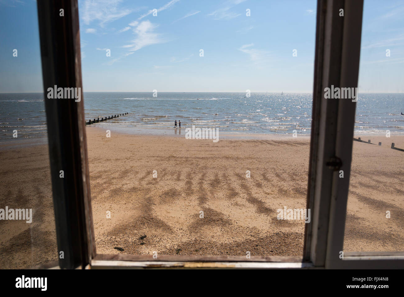 Looking out towards the beach, from the open window of a beach hut ...