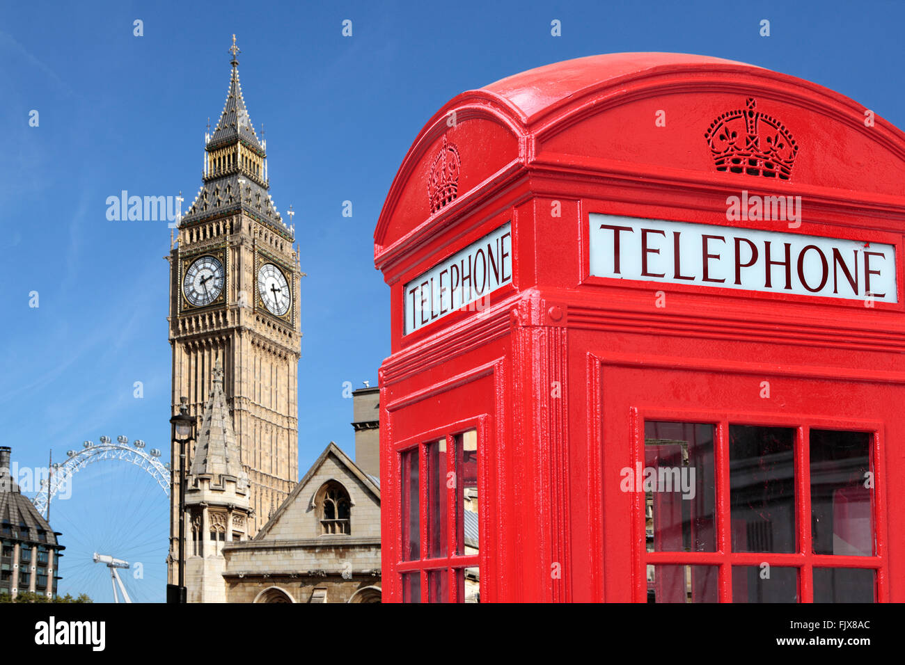 Traditional red telephone box with Big Ben out of focus in the ...