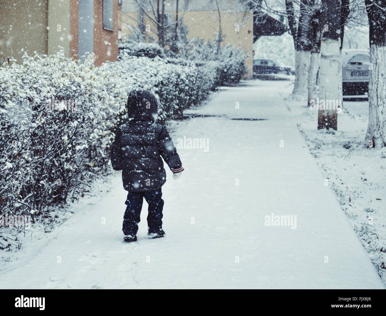 Kid walking sidewalk hi-res stock photography and images - Alamy