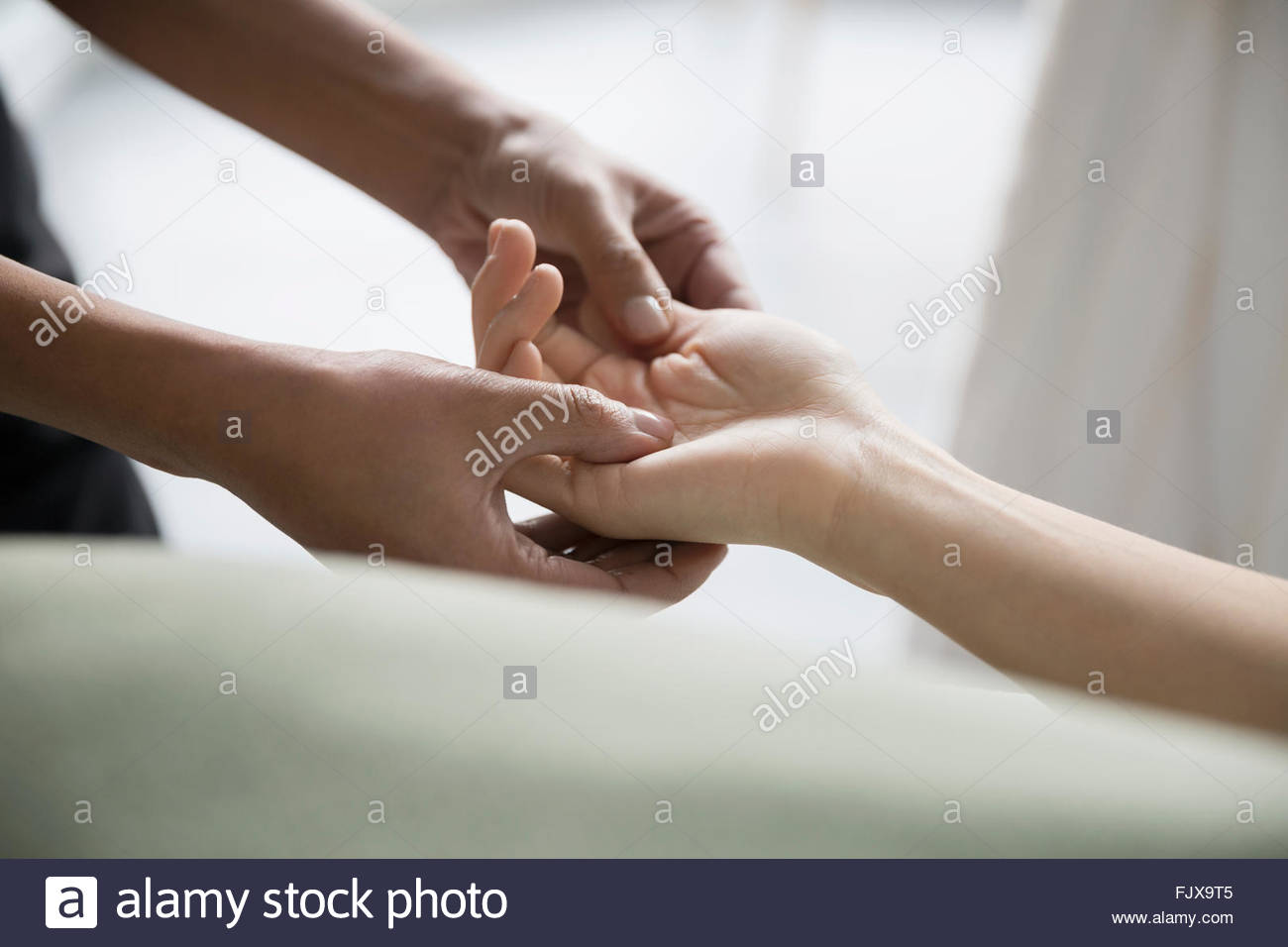 Woman receiving hand massage Stock Photo - Alamy
