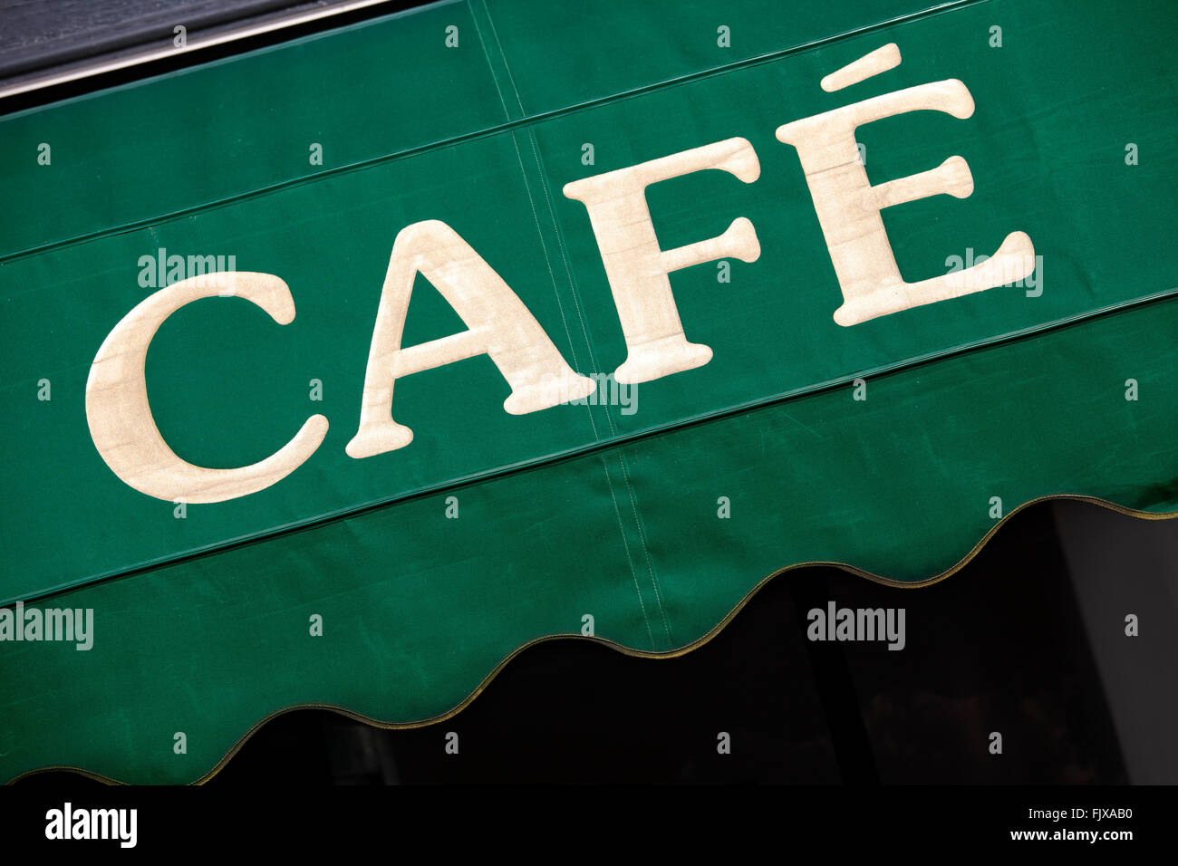 Cafe sign in Paris printed on a green entrance canopy Stock Photo - Alamy
