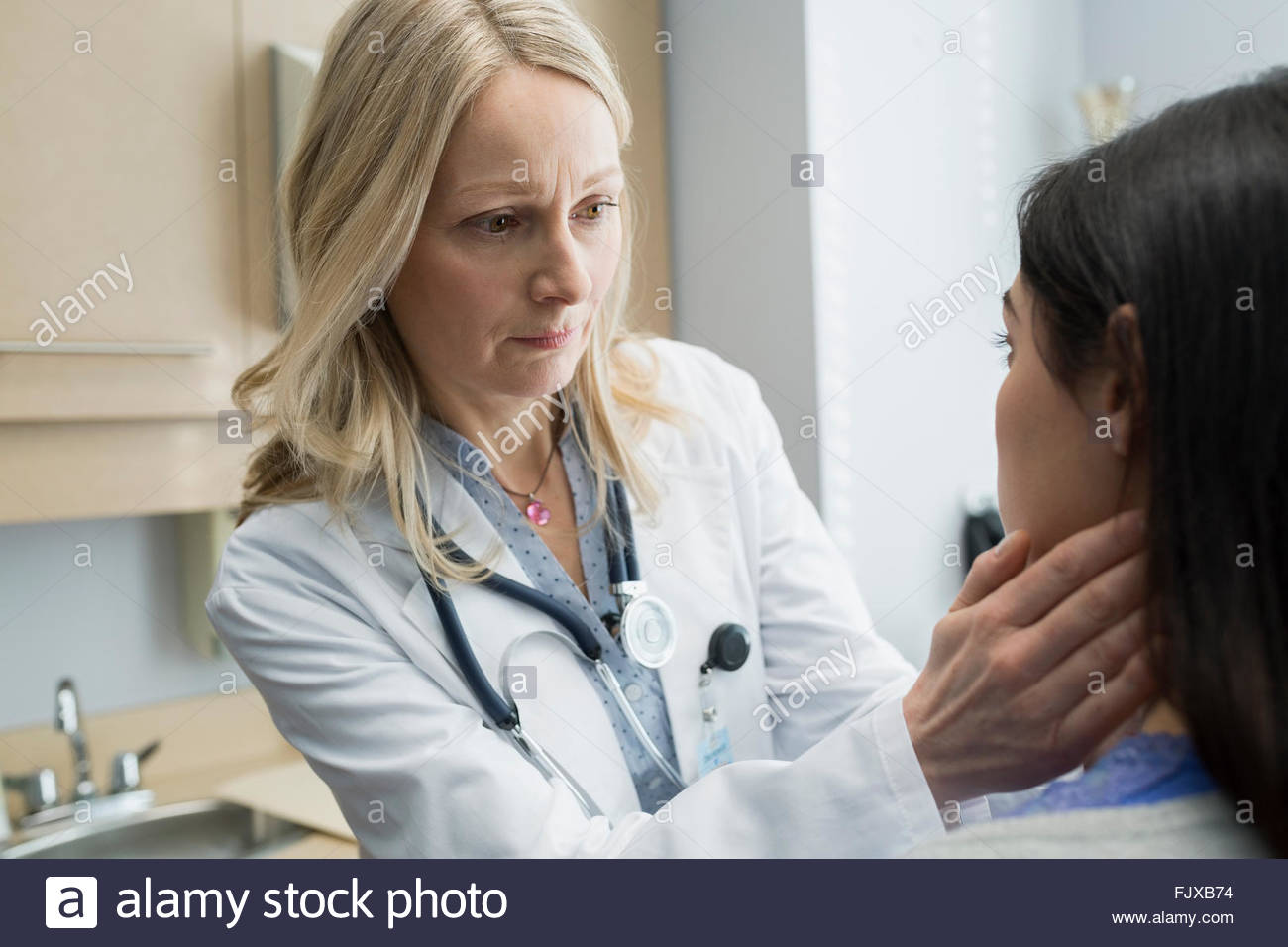 Young female doctor examination hi-res stock photography and images - Alamy