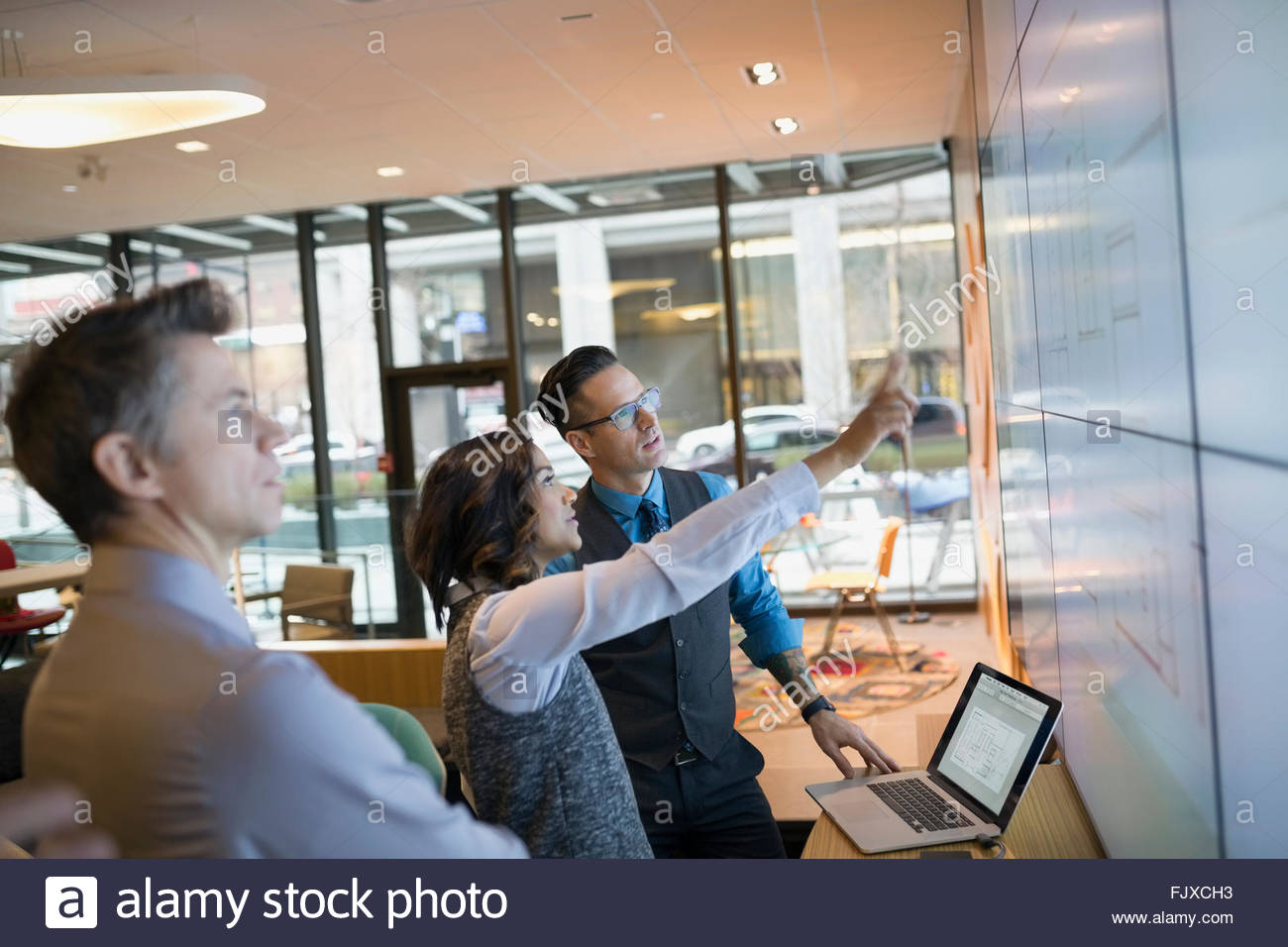 Woman presenting room screen hi-res stock photography and images - Alamy
