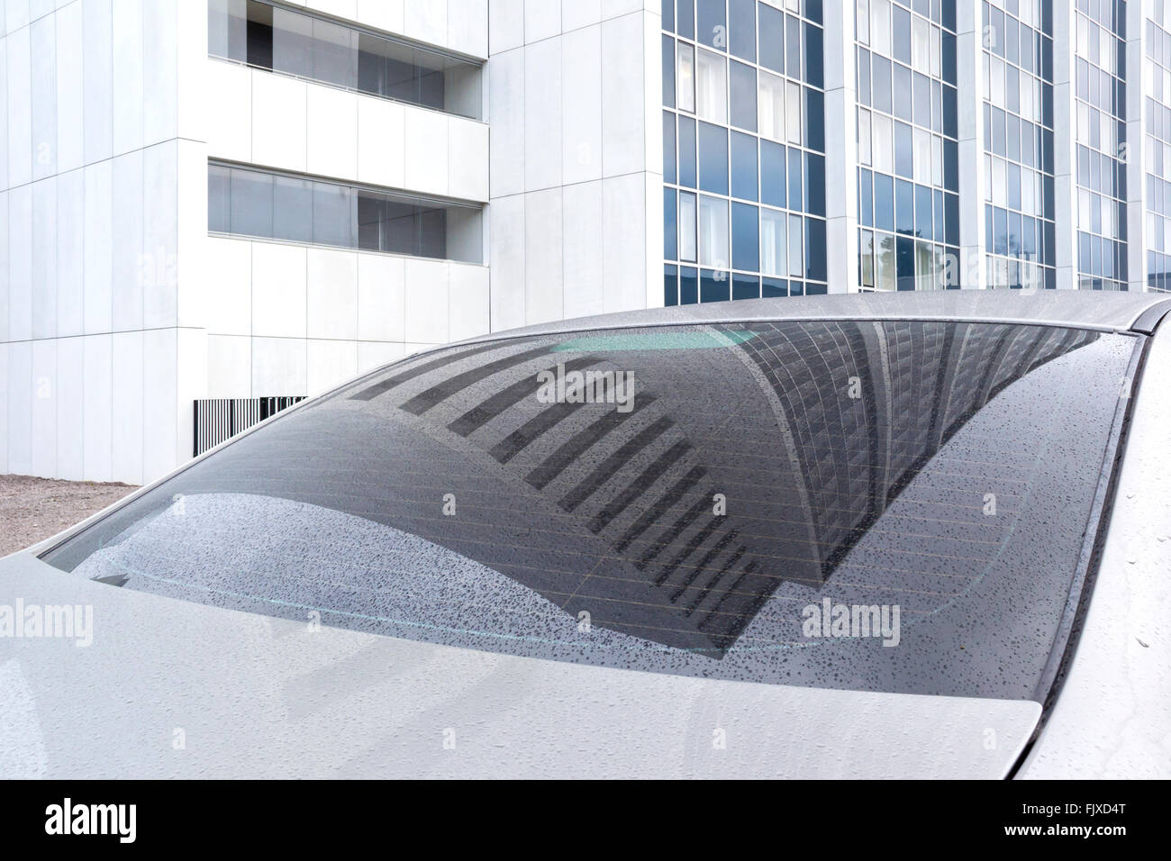 Reflection Of Building On Glass Window Of Car Stock Photo - Alamy