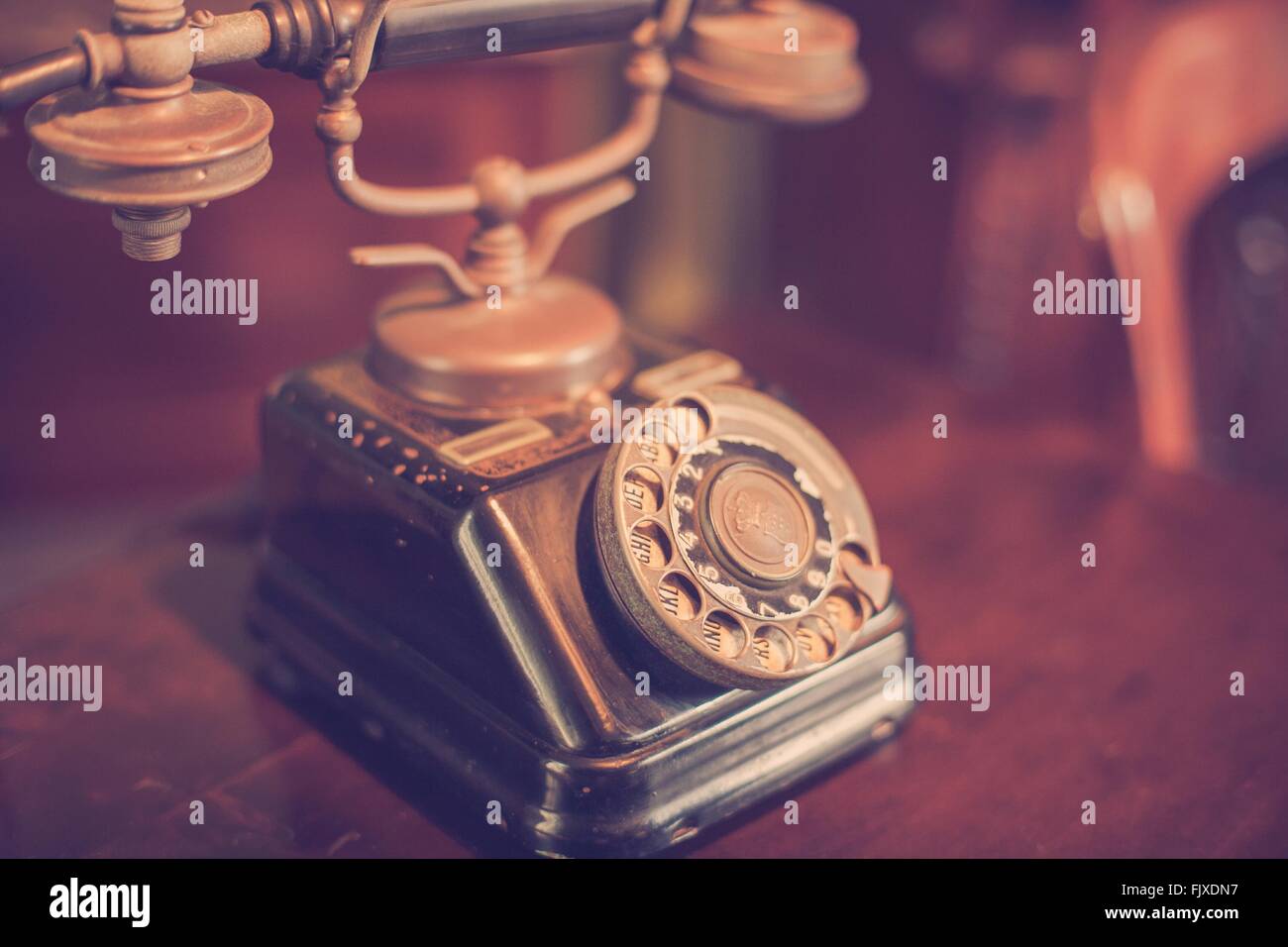 Close-Up Of Old Telephone On Table Stock Photo - Alamy