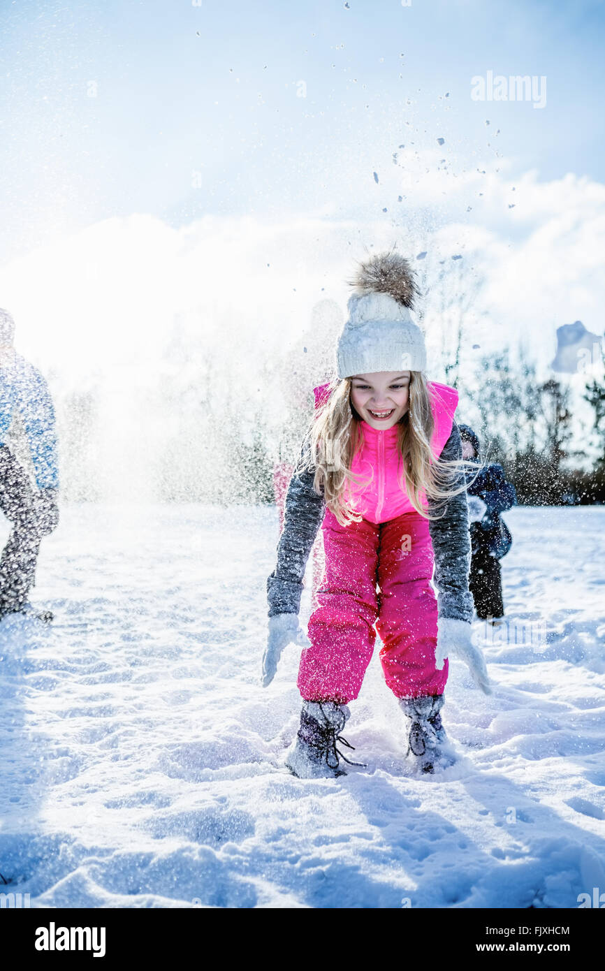 Family playing snowball fight Stock Photo - Alamy