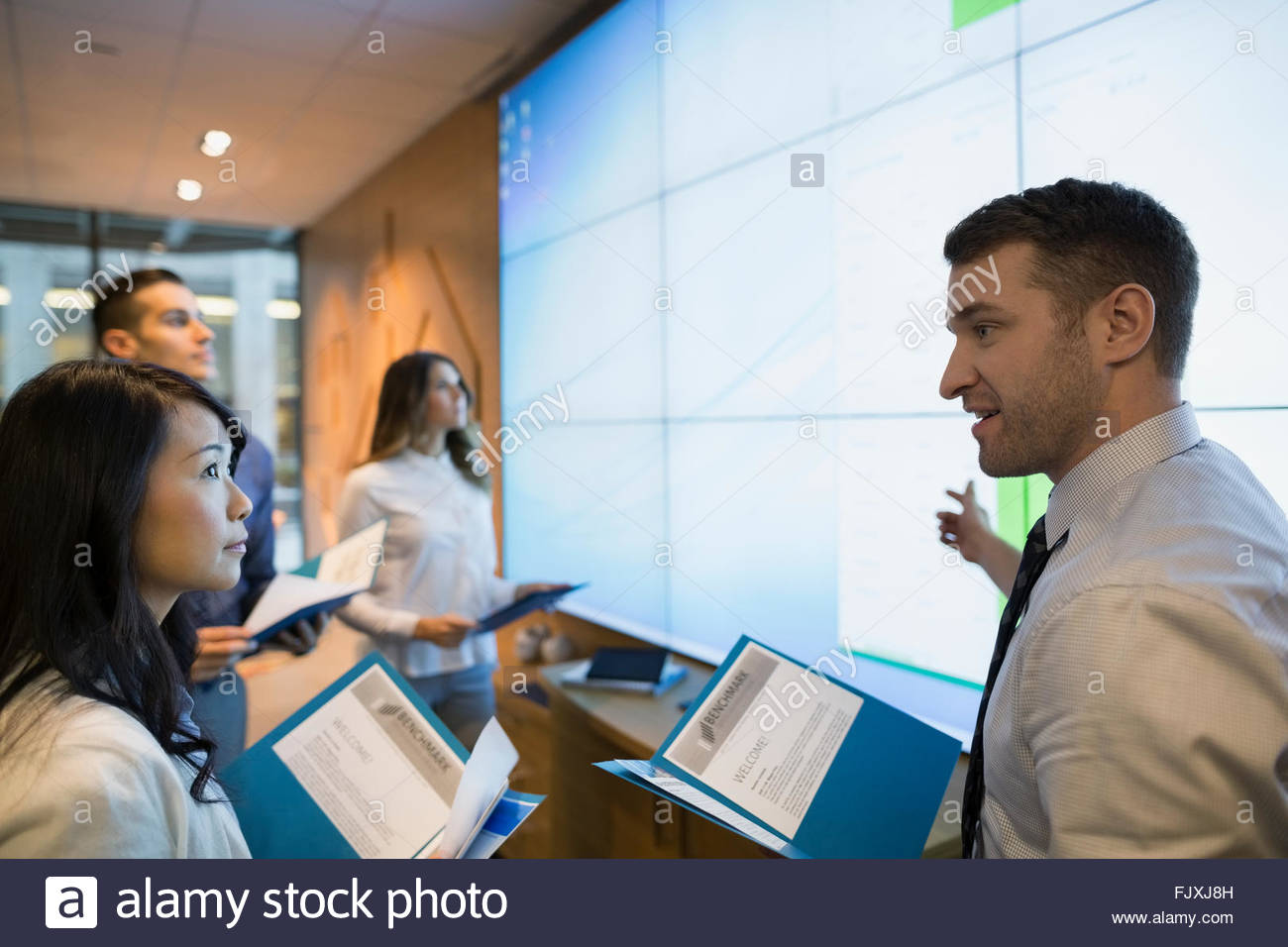 Business people meeting at projection screen conference room Stock ...