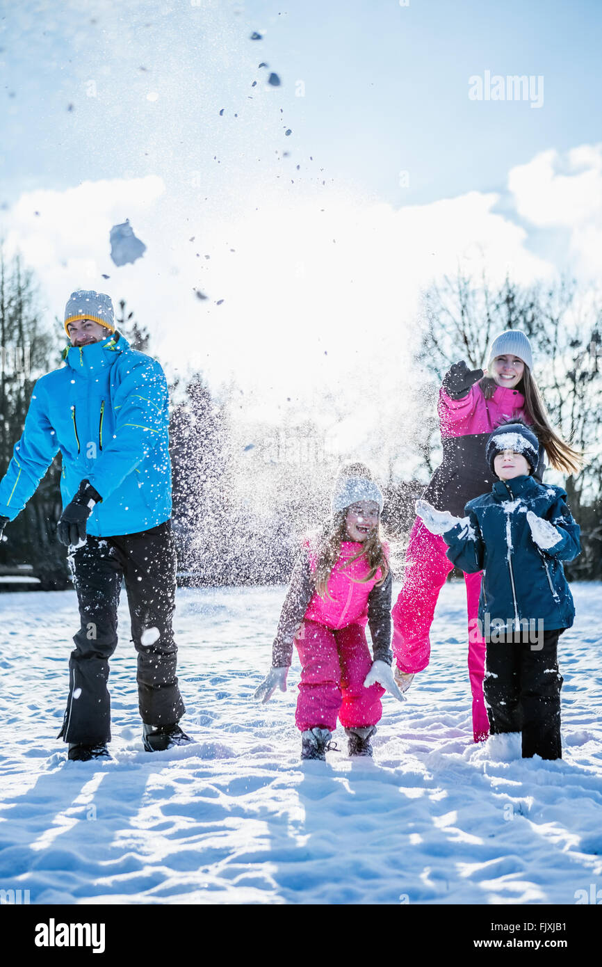 Children throwing snowballs hi-res stock photography and images - Alamy