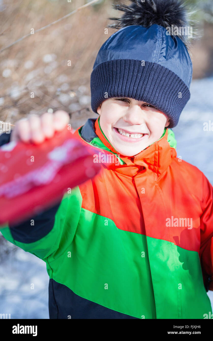 Cute boy giving present Stock Photo - Alamy