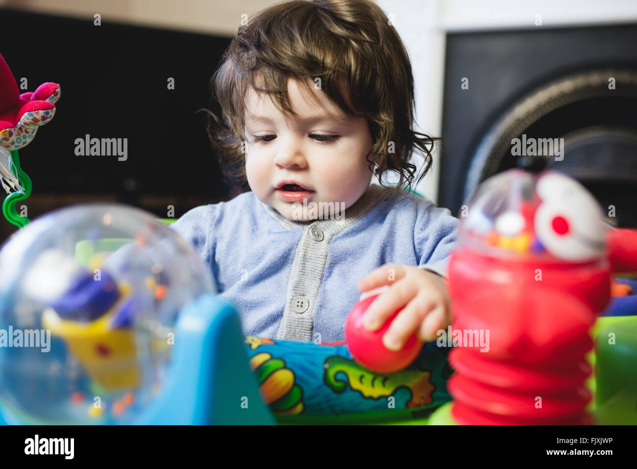 Girl playing with boy toys hi-res stock photography and images - Alamy