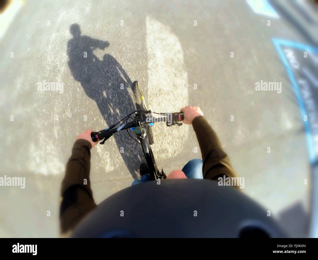 High Angle View Of Person Riding Bicycle On Road Stock Photo - Alamy