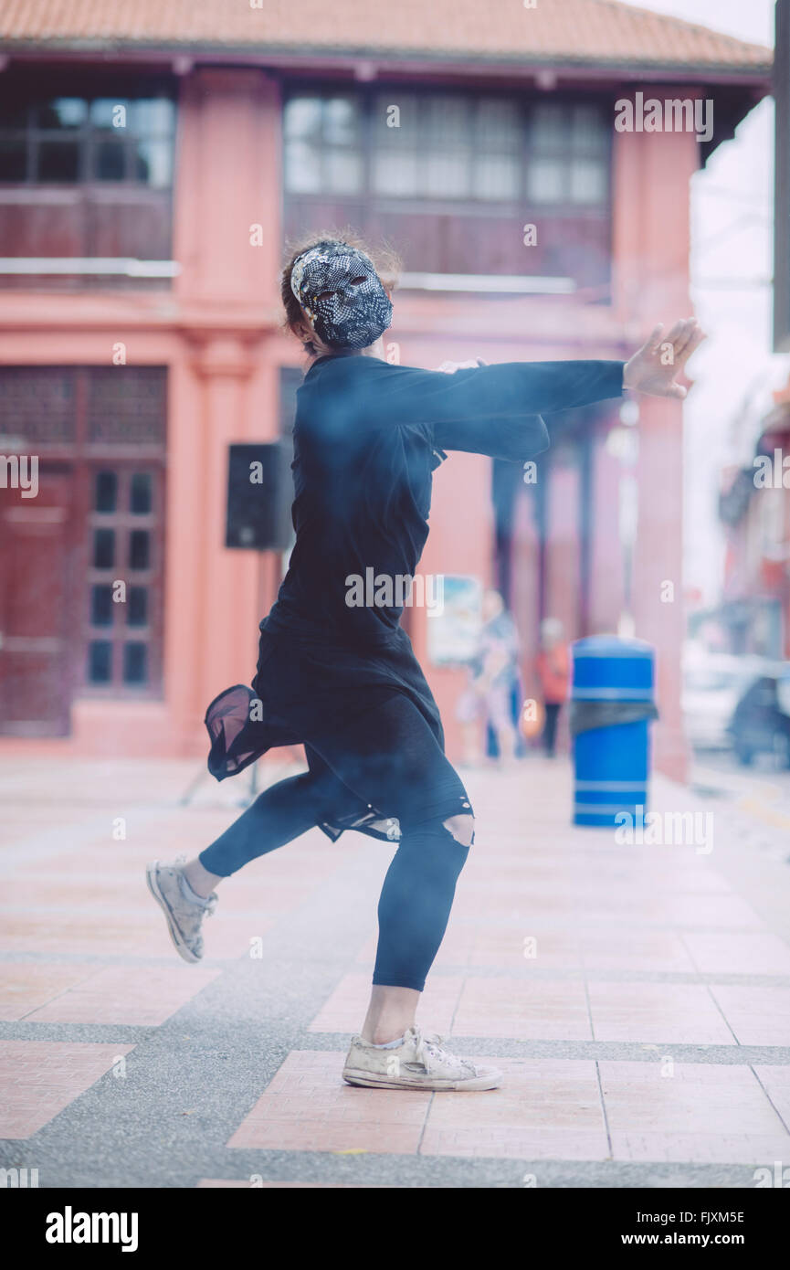 Side View Of A Woman Wearing Mask Outdoors Stock Photo - Alamy