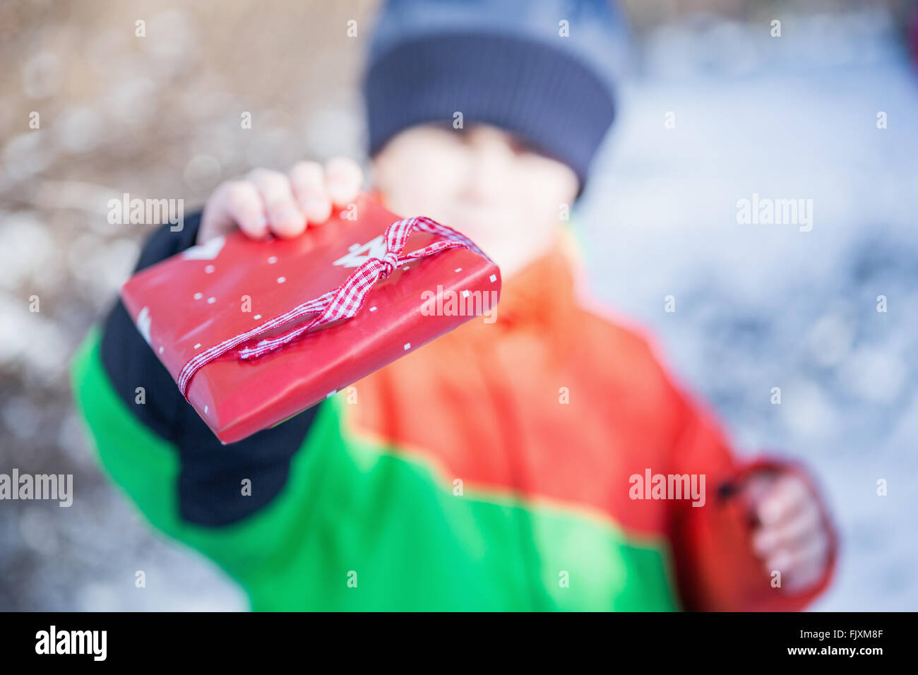 Cute boy giving present Stock Photo - Alamy