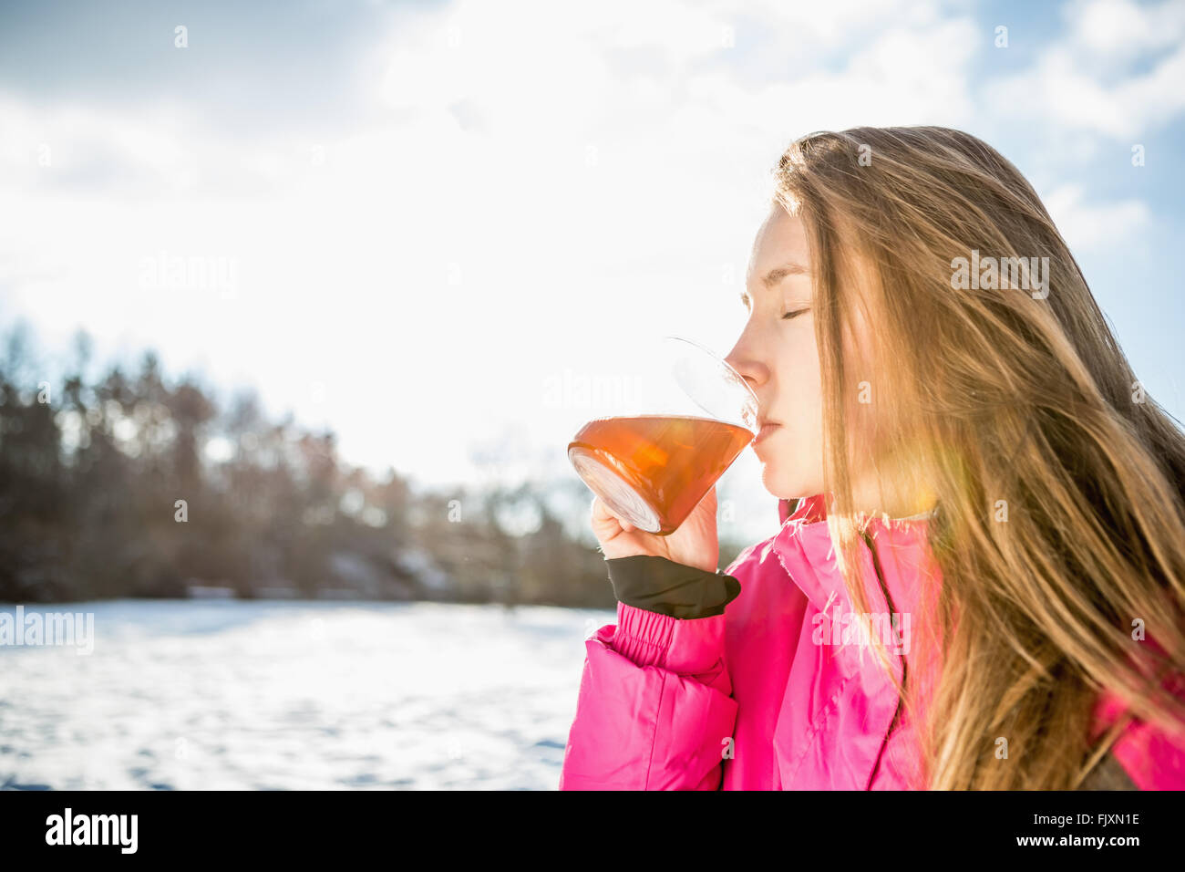 Woman drinking tea Stock Photo - Alamy