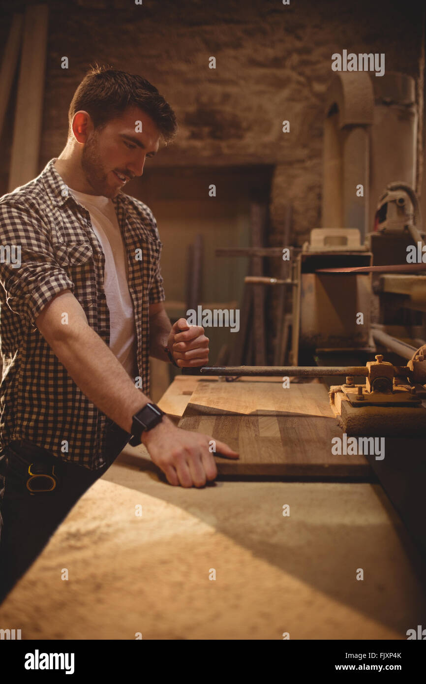 Carpenter working on his craft Stock Photo - Alamy