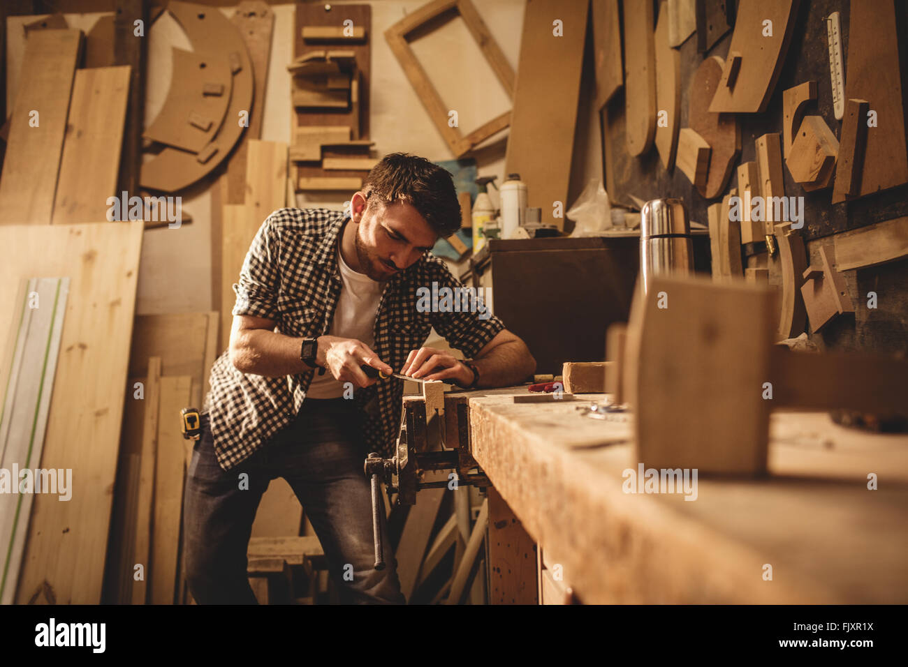 Carpenter working on his craft Stock Photo - Alamy