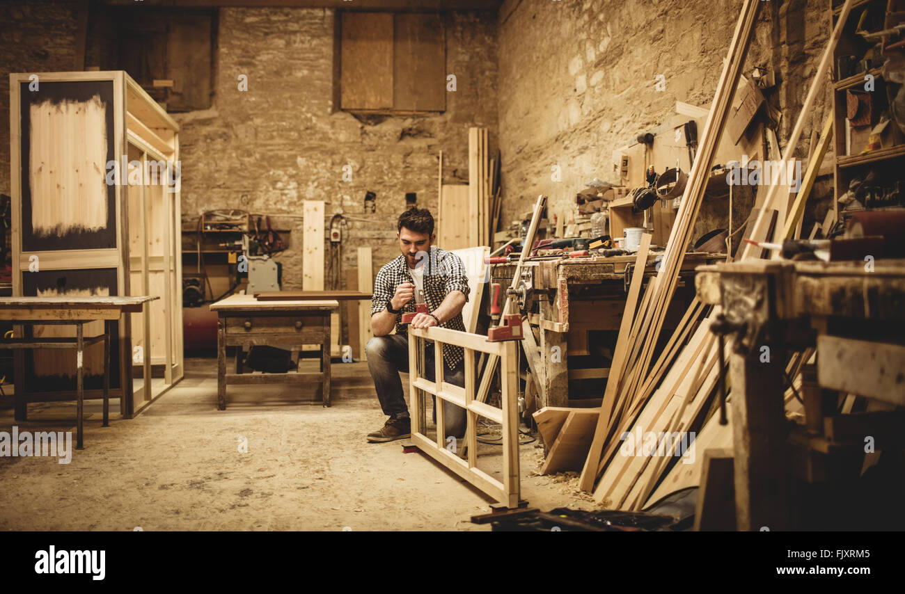 Carpenter working on his craft Stock Photo - Alamy