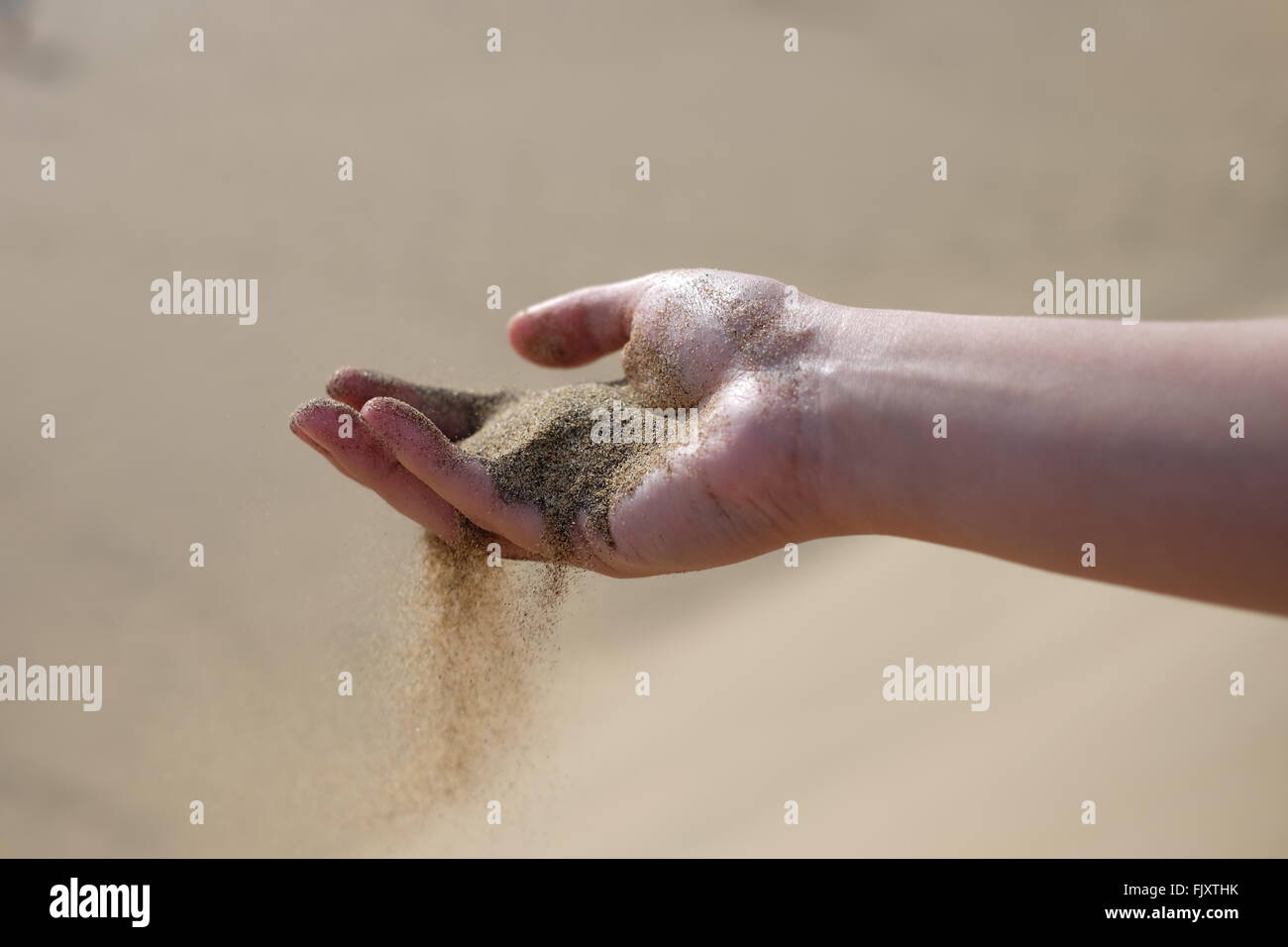 Person in sand hi-res stock photography and images - Alamy