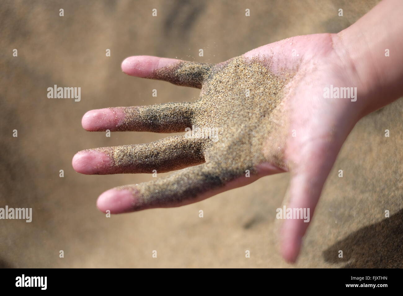 Hand in the sand hi-res stock photography and images - Alamy