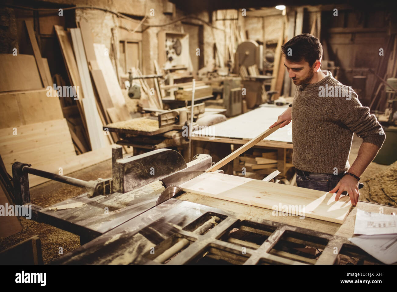 Carpenter working on his craft Stock Photo - Alamy