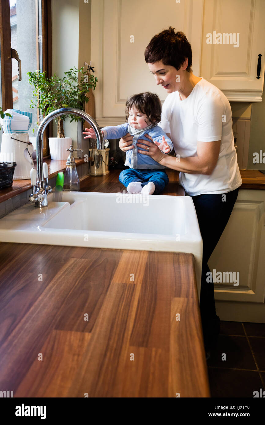 Smiling mother holding cute child hi-res stock photography and images ...